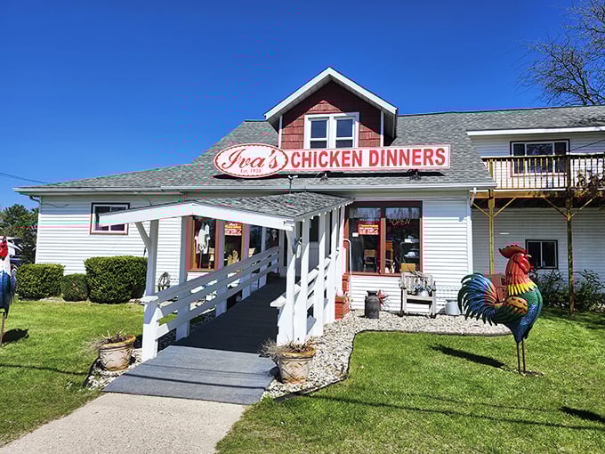 The iconic red-roofed Iva's Chicken Dinners stands like a beacon of comfort food, promising culinary salvation to hungry travelers since 1938.