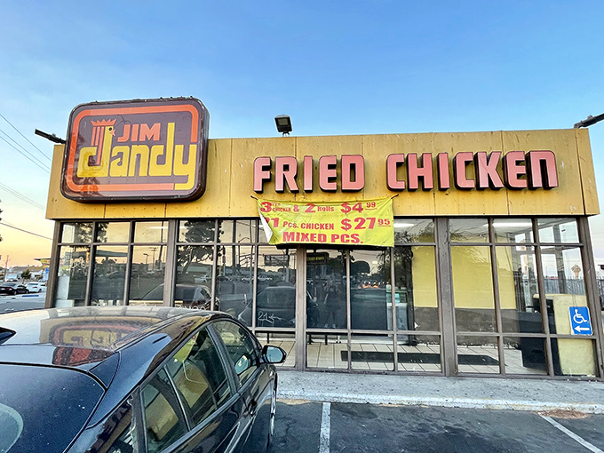 The unassuming yellow facade of Jim Dandy might not scream "culinary landmark," but that vintage sign has been guiding fried chicken pilgrims for decades.