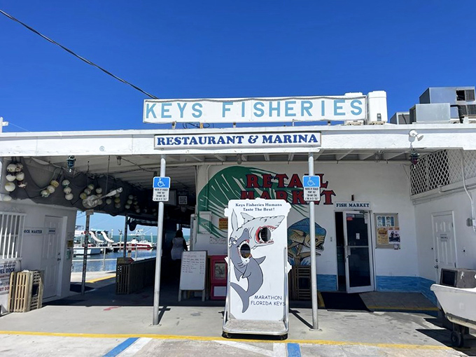 The unassuming entrance to seafood paradise. No fancy frills here&mdash;just the promise of ocean-fresh delights waiting beyond those humble doors.