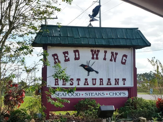 Rustic charm meets culinary excellence at this unassuming roadside gem. The red wooden exterior and stone facade promise authentic Florida country dining.