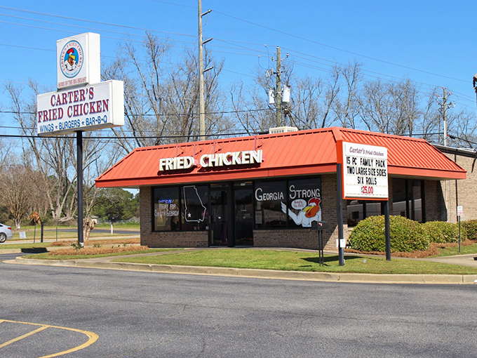 The bright orange roof of Carter's Fried Chicken stands out like a beacon of hope for hungry travelers. Georgia Strong, indeed.