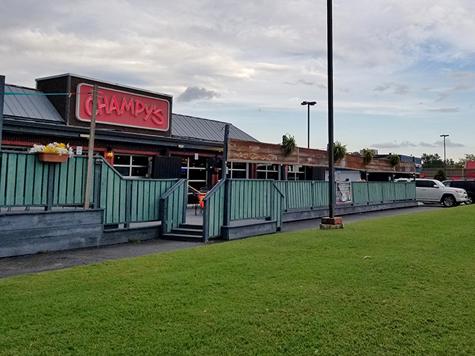 The glowing red Champy's sign beckons hungry travelers like a Southern food lighthouse guiding ships to delicious shores.