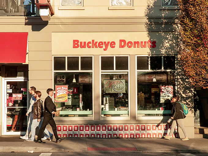 The iconic red and white storefront of Buckeye Donuts stands like a beacon of sugary hope on North High Street, promising delicious salvation 24 hours a day.