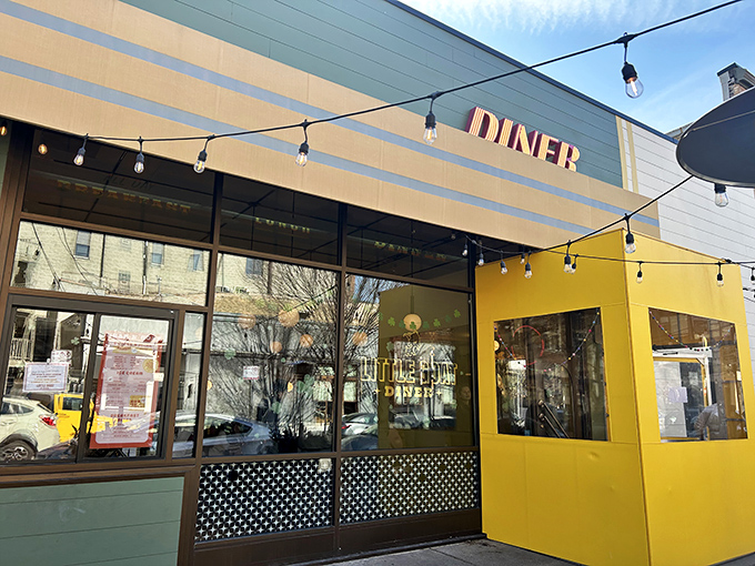 The cheerful yellow exterior of Little Goat Diner stands out like a beacon of breakfast hope on Chicago's restaurant row.