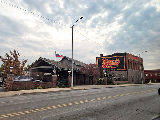 Mancy's iconic exterior stands as a beacon for steak lovers, where the neon sign has been guiding hungry Ohioans to beef paradise since 1921.