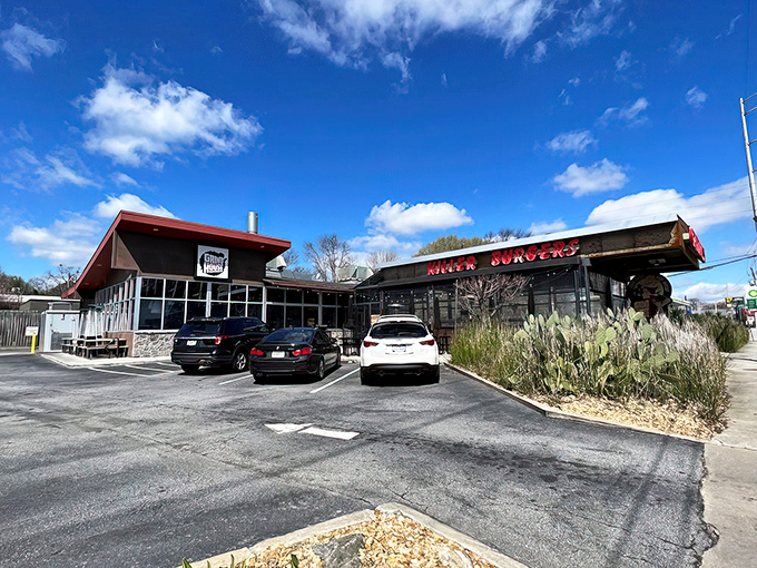 The converted gas station exterior screams "cult classic" with its bold red "KILLER BURGERS" sign – like a neon promise of delicious things to come.