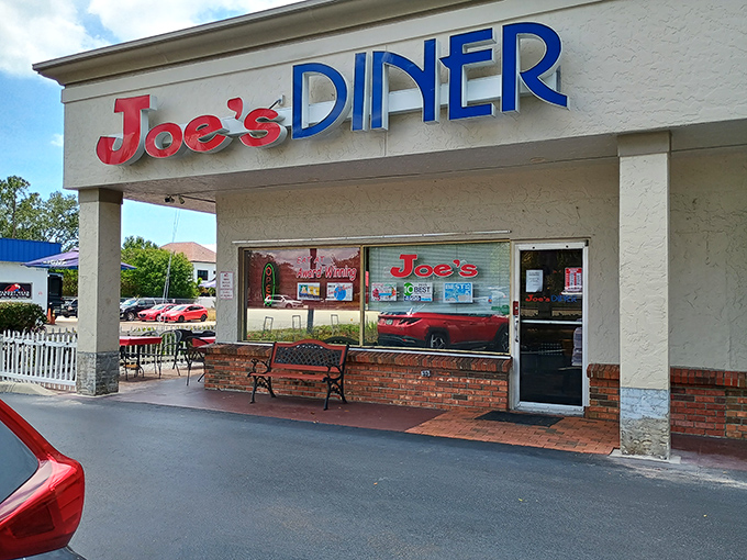 The classic red and blue signage of Joe's Diner beckons like an old friend promising comfort food and conversation in equal measure.