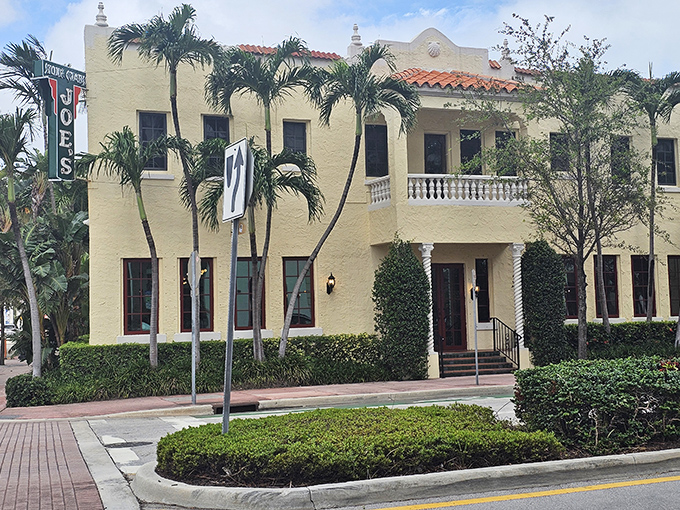 The cream-colored Mediterranean Revival building stands like a culinary lighthouse on Washington Avenue, promising seafood salvation to all who enter.