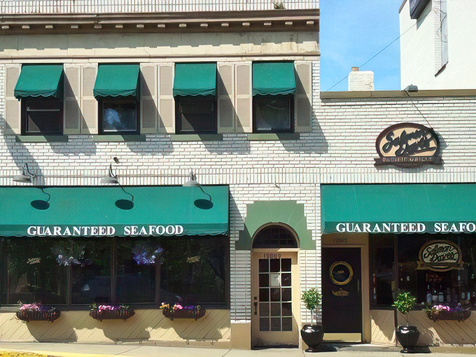 The distinctive navy blue awning signals your arrival at coastal paradise, even in landlocked Ohio. Those flower baskets aren't just pretty&mdash;they're your first hint of the attention to detail waiting inside.