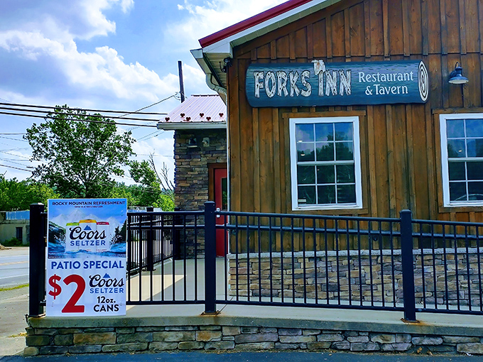 The wooden facade of Fork's Inn stands like a culinary speakeasy in Ligonier, promising treasures that belie its humble exterior.