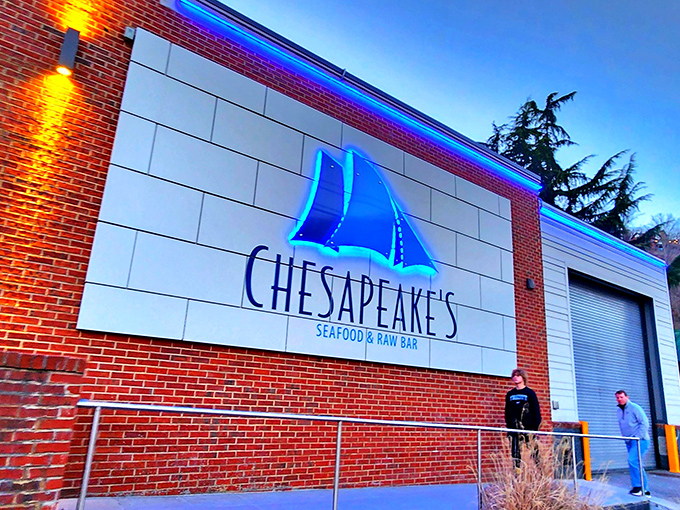 The glowing blue sailboat logo beckons seafood lovers like a lighthouse, promising an ocean of flavor in the heart of mountain country.