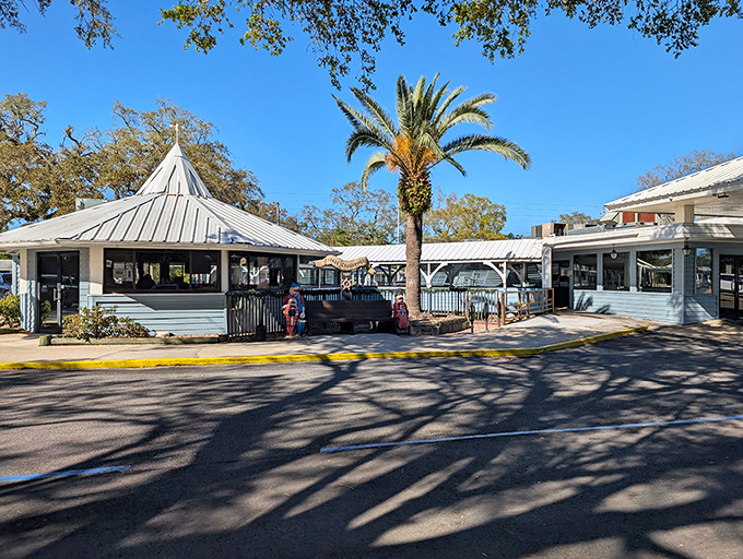 Old Florida charm meets seafood paradise at Dixie Crossroads, where those iconic white roofs and swaying palms promise delicious adventures await inside.