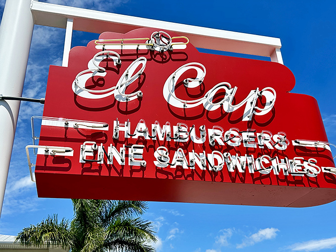 The classic red sign beckons like an old friend on 4th Street North. No pretense, just the promise of legendary burgers waiting inside.