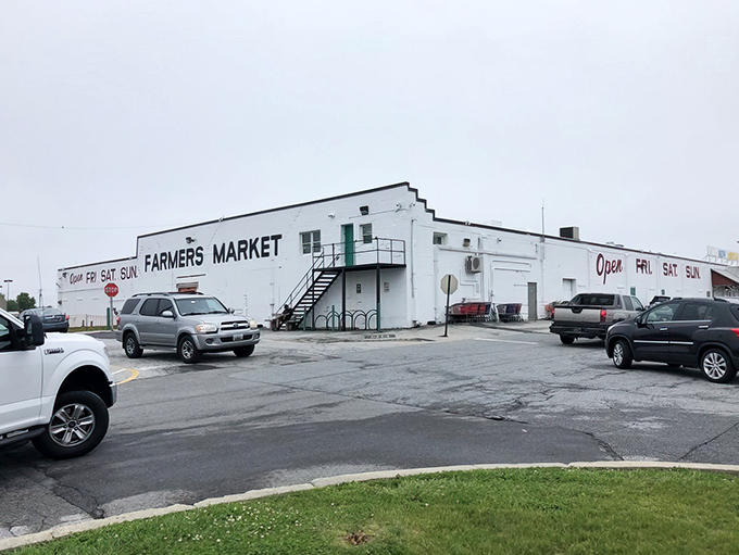 The unassuming white exterior of New Castle Farmers Market stands like a culinary speakeasy &ndash; nothing fancy outside, pure magic inside. Friday through Sunday only, folks!
