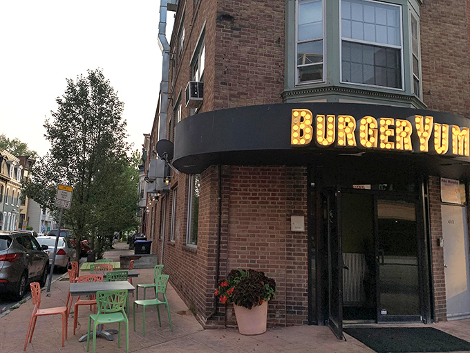 That marquee sign isn't just illuminated&mdash;it's making a promise your taste buds will thank you for keeping. Corner charm at its finest.