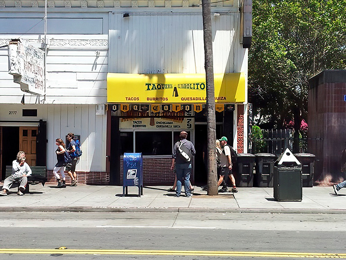 That iconic yellow awning isn't just a sign—it's a beacon of hope for hungry souls wandering Mission Street in search of burrito perfection.