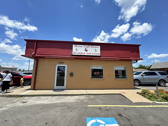 The unassuming red awning and brick exterior might fool you, but culinary treasures await inside this humble Texas landmark. No Michelin stars needed here.