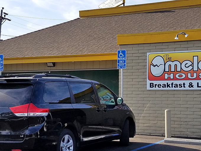 The unassuming yellow-trimmed exterior of The Omelet House might not scream "breakfast paradise," but locals know better than to judge this egg sanctuary by its shell.