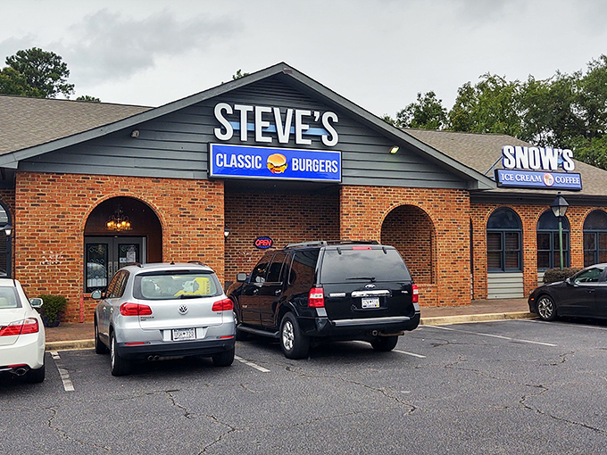 Steve's Classic Burgers stands proudly in its brick-faced glory, like that reliable friend who's always there when hunger strikes. The neighboring Snow's Ice Cream promises a sweet finale.
