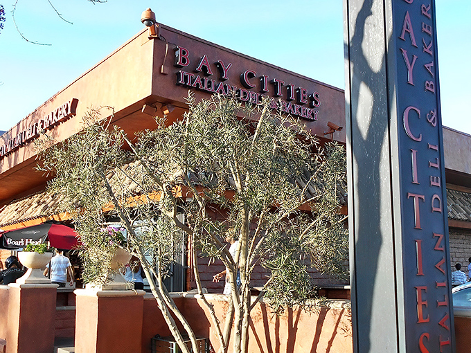 The terracotta-colored building stands like a culinary lighthouse on Lincoln Boulevard, its "As Italian as it gets!" umbrellas promising authentic delights within.