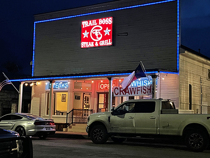 The neon-outlined Trail Boss sign glows like a beacon for hungry travelers. This unassuming exterior houses culinary treasures that would make any cowboy weep with joy. 