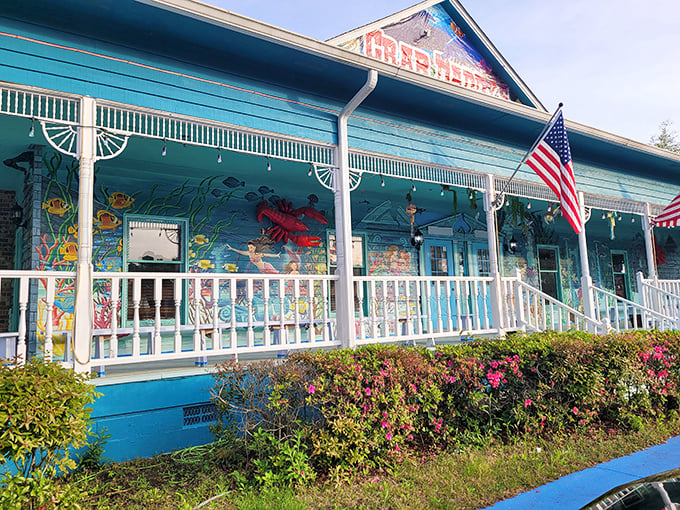 The teal-blue exterior of Crab Daddy's beckons like a siren call to seafood lovers. That glowing "OPEN" sign might as well say "PARADISE FOUND."