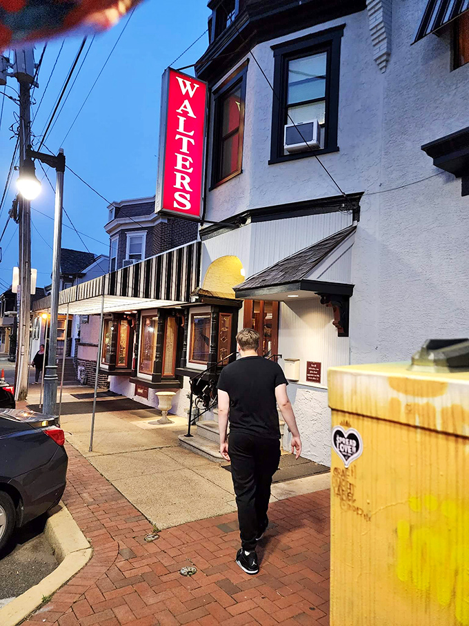 The iconic red WALTERS sign beckons hungry carnivores like a lighthouse guiding ships to safe harbor. Dinner awaits!