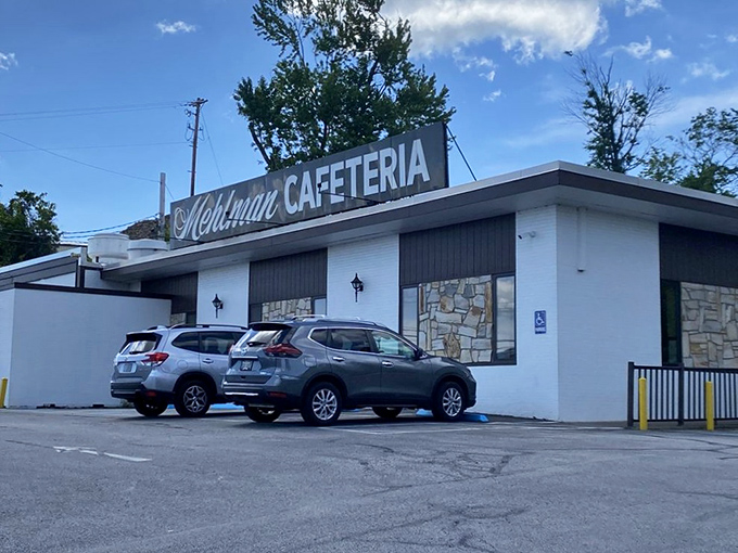 The unassuming white exterior of Mehlman Cafeteria stands like a culinary time capsule, promising comfort food treasures within those brick walls.