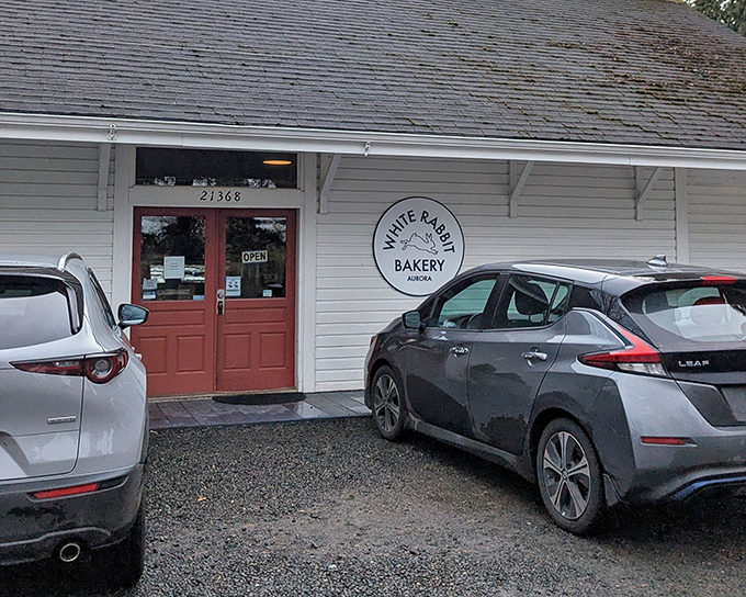 The unassuming exterior of White Rabbit Bakery, with its coral-colored doors, proves once again that the best culinary treasures often hide in plain sight.