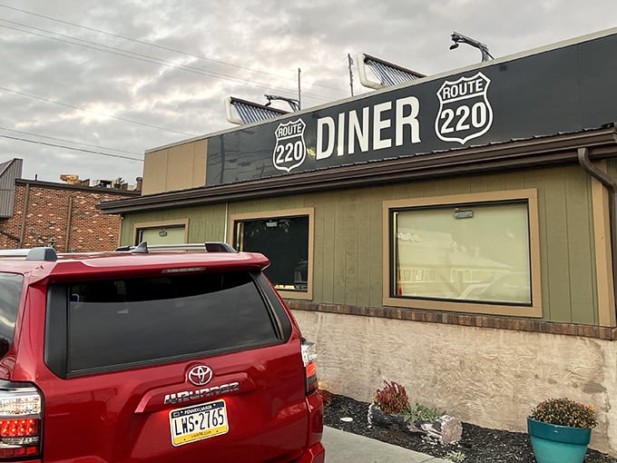 The unassuming exterior of Route 220 Diner stands like a culinary lighthouse on Bedford's roadside, promising comfort food salvation to hungry travelers and locals alike.