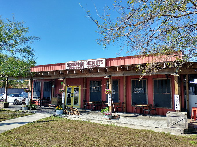 That rustic red exterior with sunny yellow doors isn't just Florida charm&mdash;it's your signal that sandwich nirvana awaits inside.