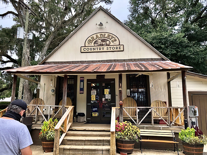 The weathered white facade of Bradley's Country Store stands like a time capsule among towering oaks, promising culinary treasures that Instagram influencers haven't yet ruined. 