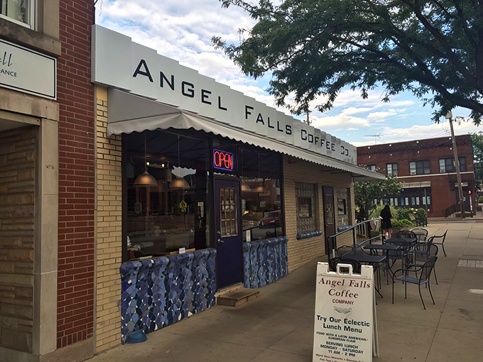 The welcoming storefront of Angel Falls beckons like an oasis in Highland Square, promising caffeinated salvation and pastry-based happiness to weary travelers.