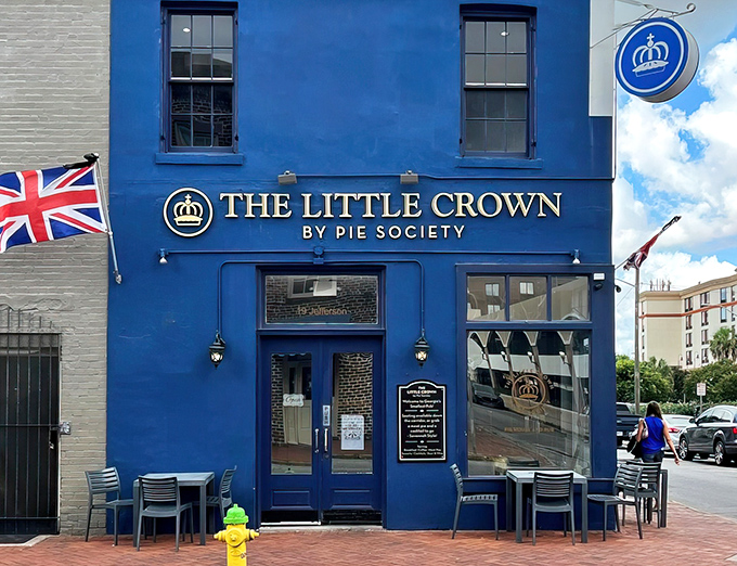 The navy blue awning of Pie Society beckons like a British flag in Savannah's historic district, promising proper pastries and afternoon tea.