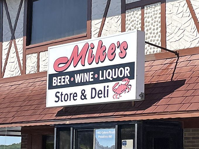 The Tudor-style charm of Mike's Crabhouse stands proudly against Maryland's blue skies, promising seafood treasures within those distinctive red-tiled roofs.