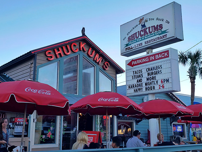 The weathered exterior of Shuckums screams "authentic local spot" with its classic signage and outdoor seating. Florida seafood joints don't get more genuine than this.