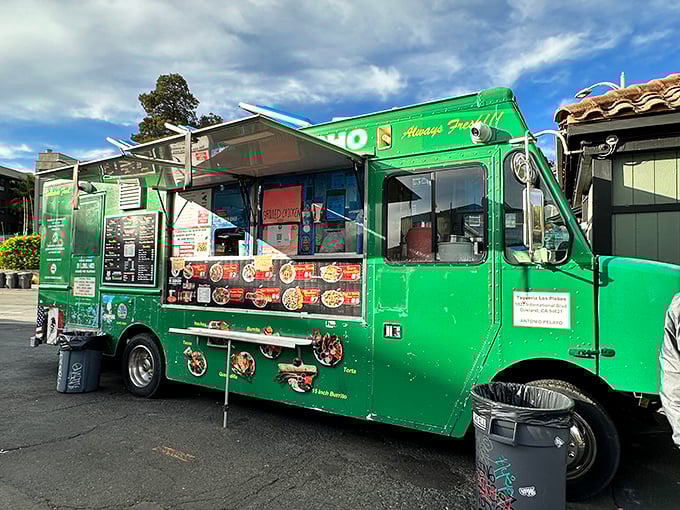 The emerald-green chariot of culinary dreams sits ready for action. Tacos Mi Rancho's vibrant food truck promises Mexican delights that'll make your taste buds stand at attention.