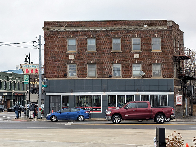Detroit's Corktown neighborhood hides this brick-clad treasure with its iconic vintage sign and whimsical red bull sculpture. Burgers await inside!