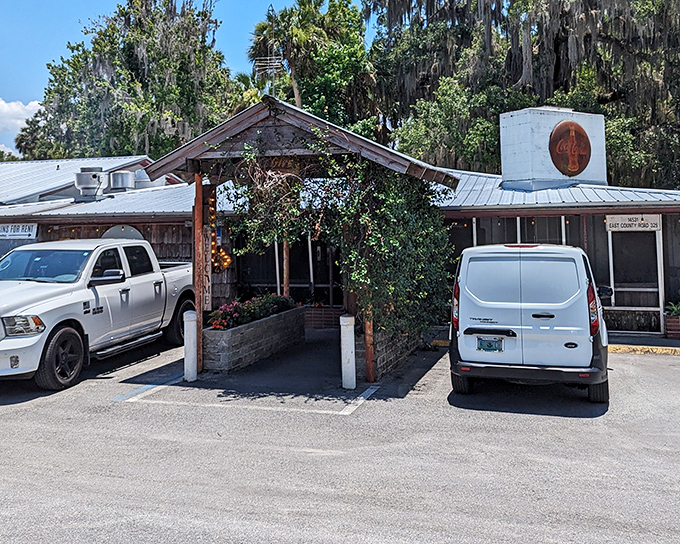 The unassuming exterior of The Yearling, complete with vintage Coca-Cola sign and that whimsical metal moon sculpture, promises authentic Florida without the tourist brochure gloss.