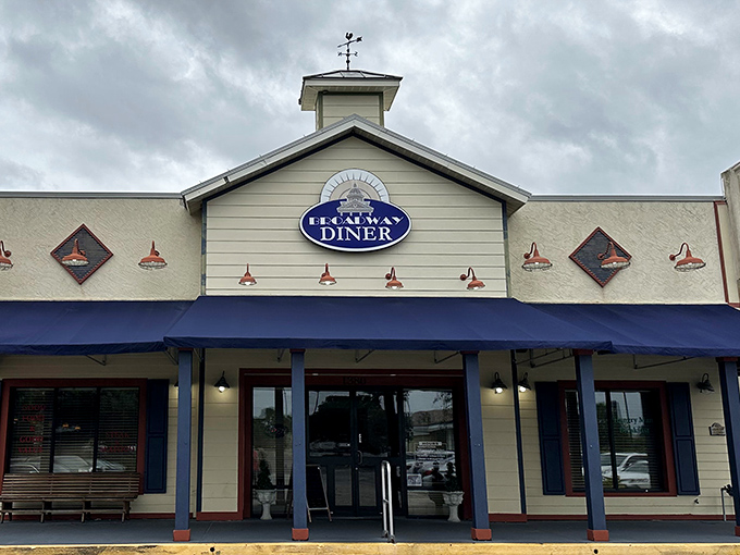 The classic blue awning and charming facade of Broadway Diner in Bartow stands as a beacon for breakfast lovers seeking comfort food perfection.
