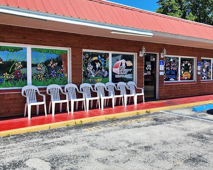 The beach-themed window art at this unassuming roadside gem promises Florida flavor, while the line of hungry patrons suggests breakfast treasures await inside.