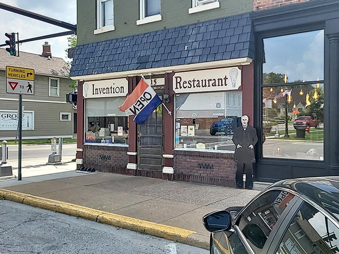 The iconic facade of Invention Restaurant, where a Thomas Edison cutout stands guard, reminding visitors they're about to experience some truly illuminating comfort food.