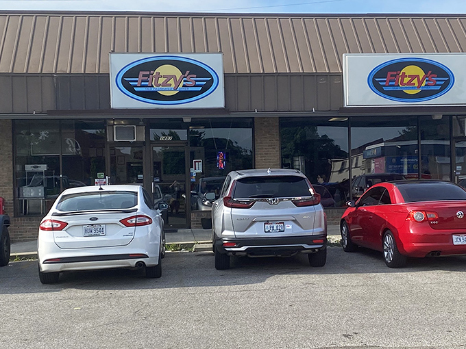 The unassuming exterior of Fitzy's belies the culinary treasures within. That blue oval sign has become a beacon for hungry Columbus locals seeking comfort food perfection.