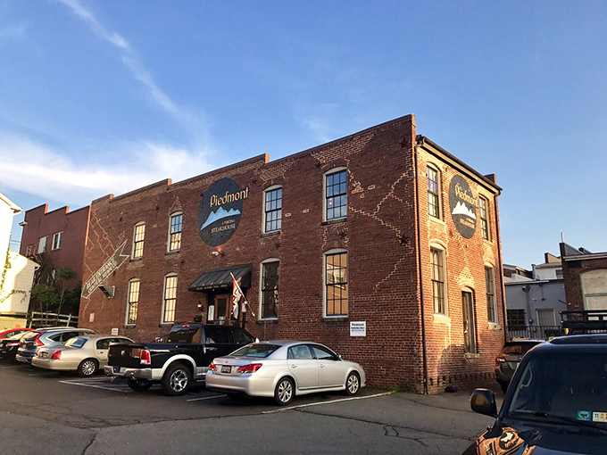 The historic brick exterior of Piedmont Steakhouse stands like a culinary fortress in downtown Culpeper, promising treasures within that the modest façade only hints at.