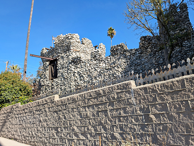 Stone by stone, a fantasy rises from suburban reality. Rubel Castle's imposing entrance looks like it teleported straight from medieval Europe to Southern California.