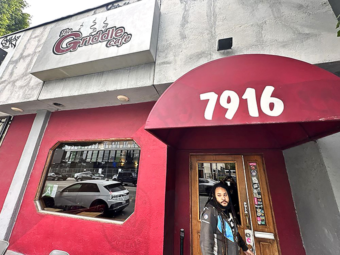The iconic red awning of The Griddle Cafe beckons hungry Angelenos like a breakfast lighthouse on Sunset Boulevard.
