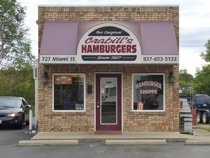 The unassuming brick exterior of Crabill's Hamburger Shoppe proves that culinary greatness often comes in small packages. This tiny burger temple has been an Urbana institution for generations.