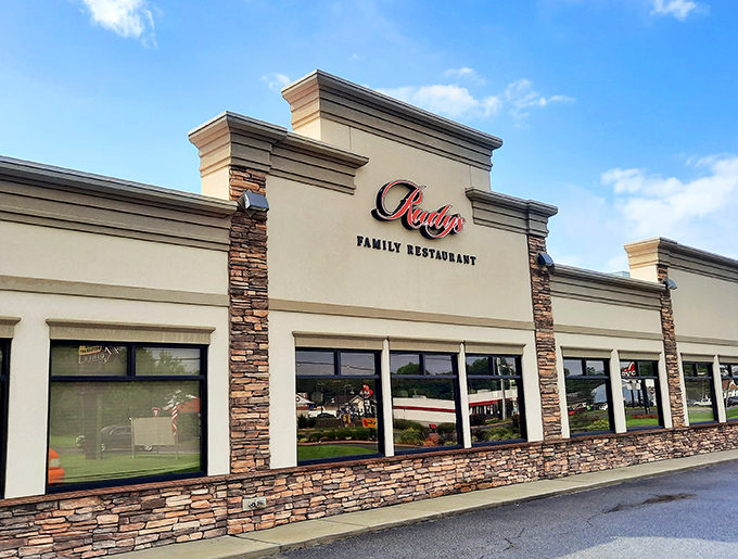 Rudy's welcoming stone facade stands like a breakfast beacon in Harrington, promising comfort food treasures within those large windows.