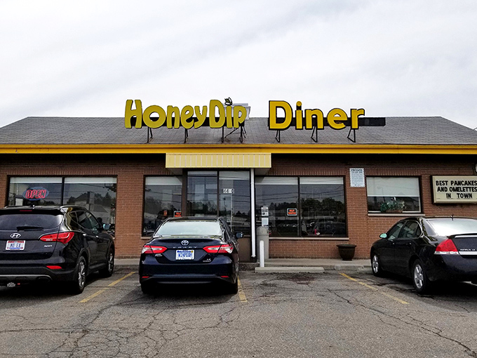 The bright yellow HoneyDip sign beckons like a breakfast lighthouse, guiding hungry souls to this Columbus institution where calories don't count before noon.