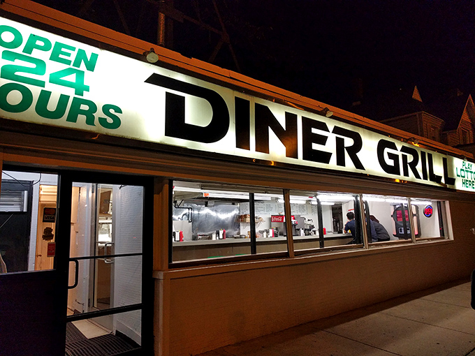 The neon "OPEN 24 HOURS" sign glows like a lighthouse for hungry night owls, promising salvation in the form of perfectly griddled comfort food.